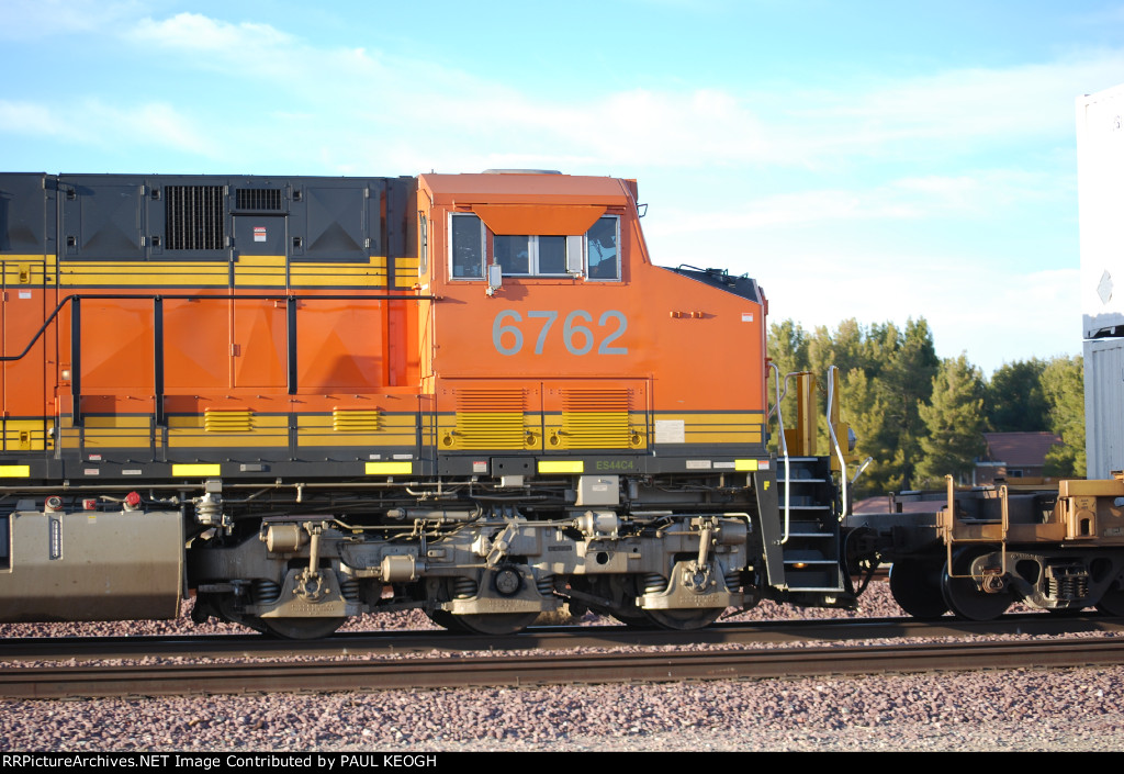 Side Cab Shot of BNSF 6762 as the #4 unit behind BNSF 7565.